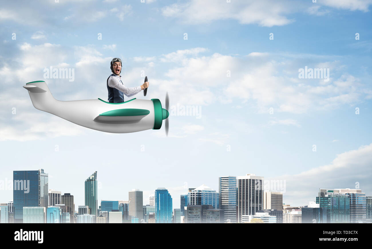 Scared pilot with open mouth in airplane Stock Photo - Alamy