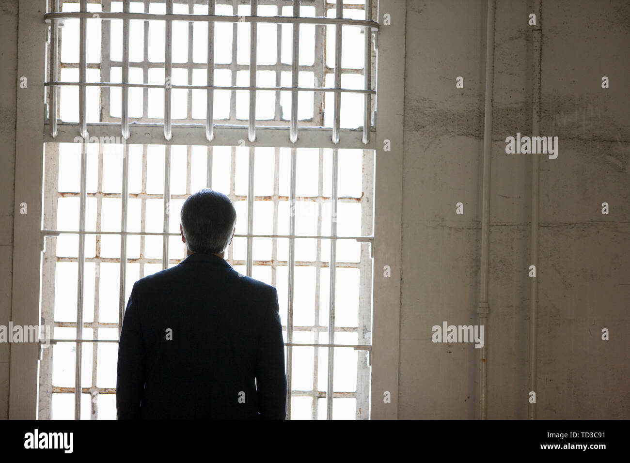 Stand inside bars hi-res stock photography and images - Alamy