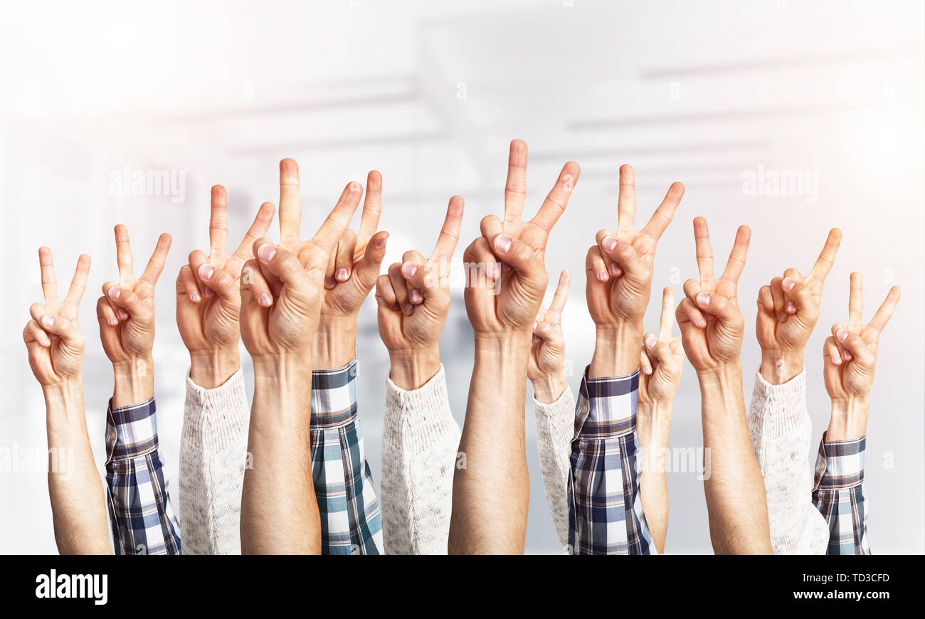 Two hands showing victory sign hi-res stock photography and images - Alamy