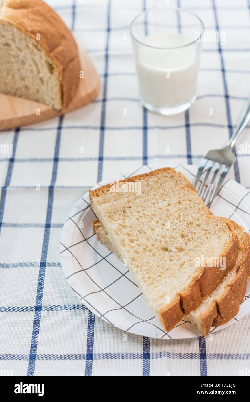 Breakfast, sliced bread and milk Stock Photo - Alamy