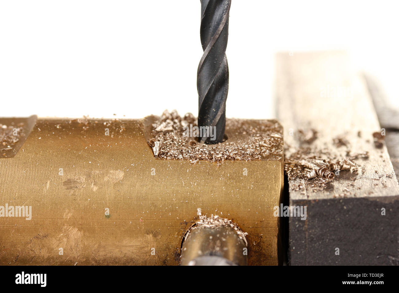 Drilling hole into metal, isolated on white Stock Photo - Alamy