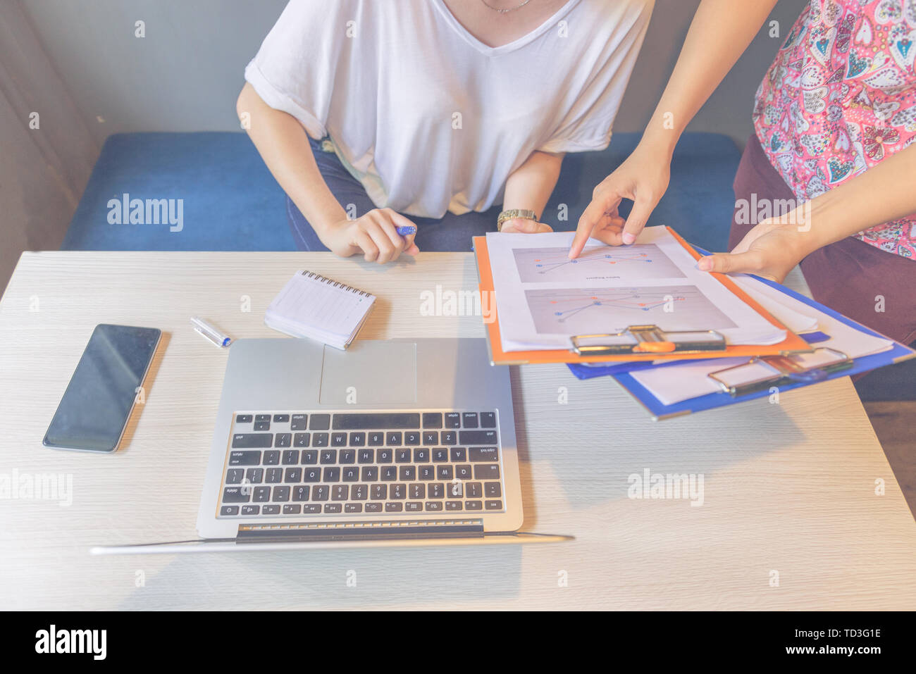 Close up photo of woman hand pointing at chart document Stock Photo - Alamy