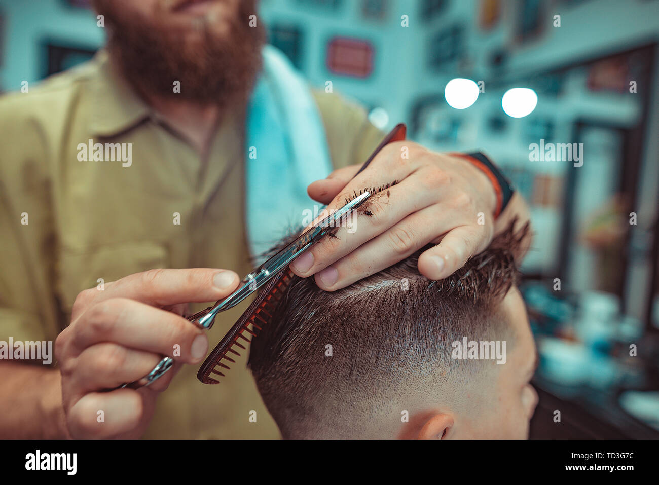 The work of the hairdresser. The client receives barber services Stock ...