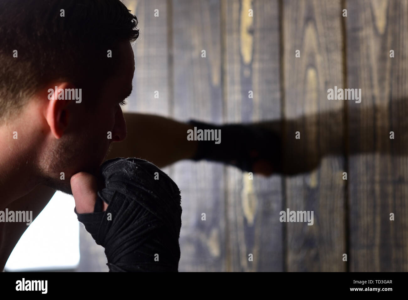 power. power man punch wooden wall. man has a lot of power. boxer man ...