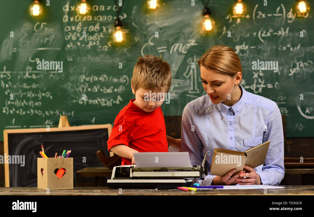 Professor and school student at the classroom in a school, Teacher sets ...