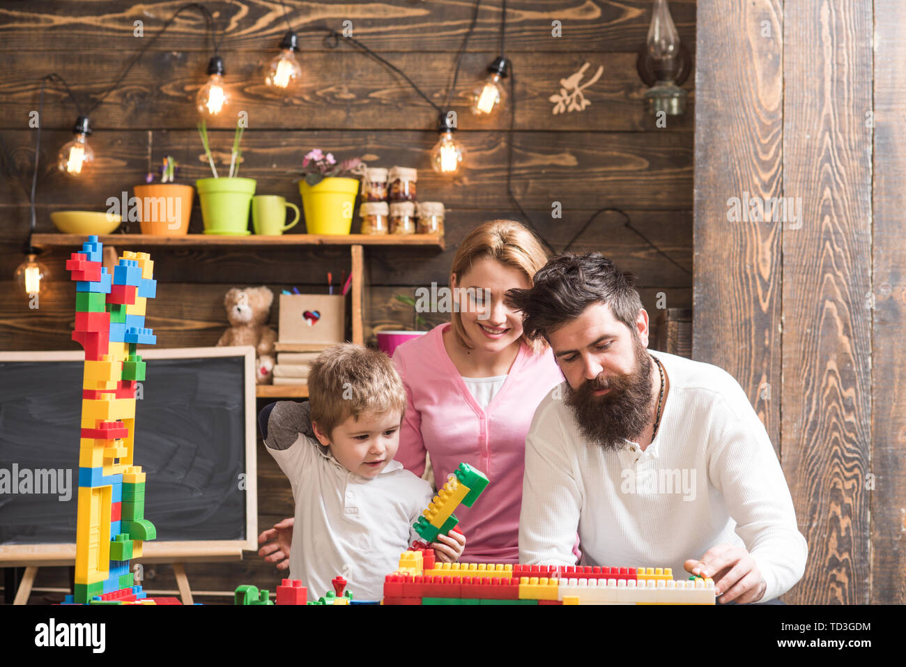 Kindergarten concept. Little boy play with toy bricks in kindergarten ...