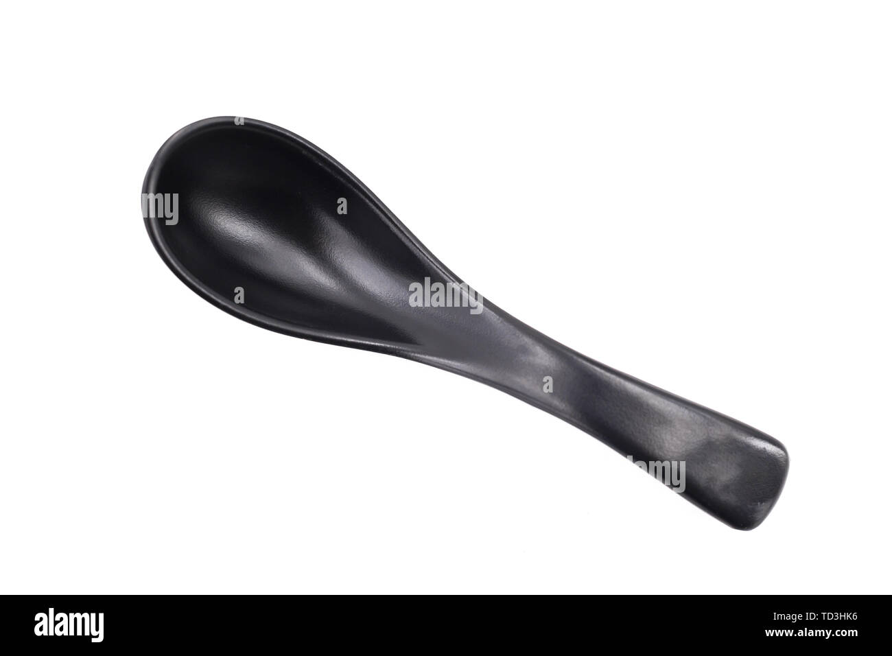 Black spoon on white background Stock Photo - Alamy
