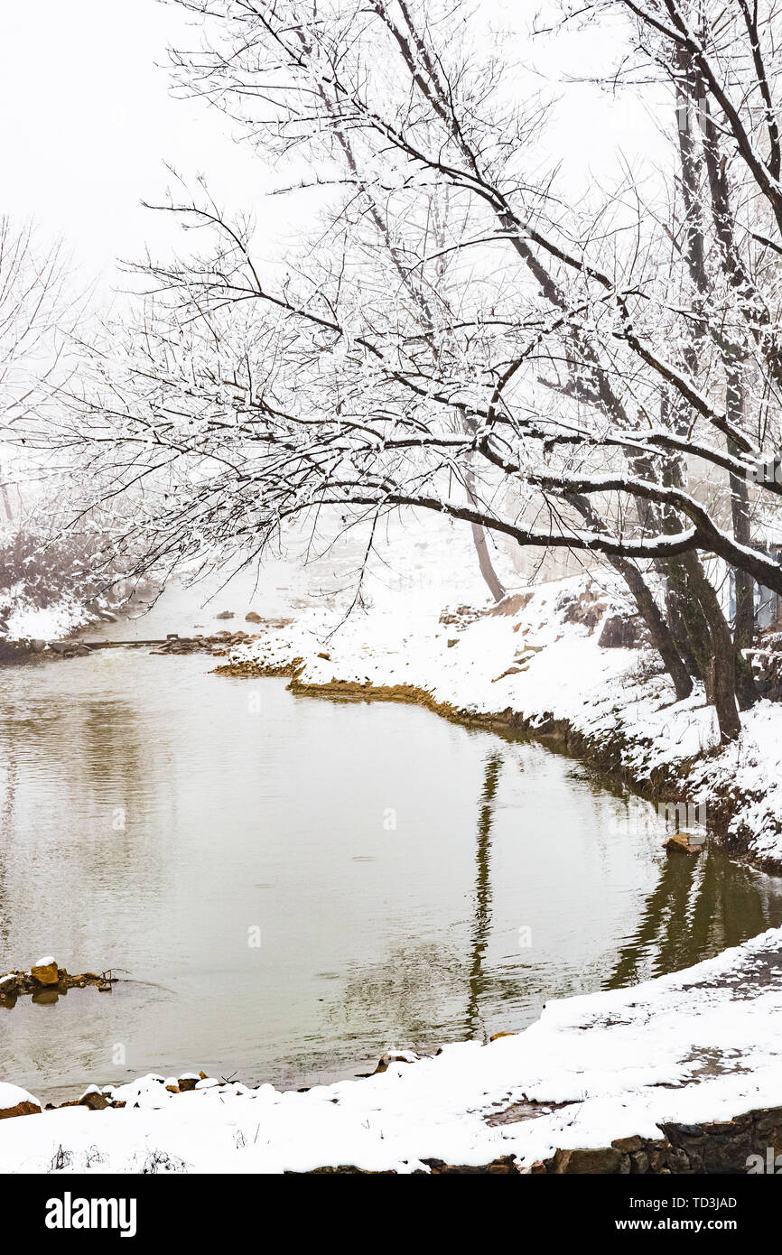 Snow on the river Stock Photo - Alamy