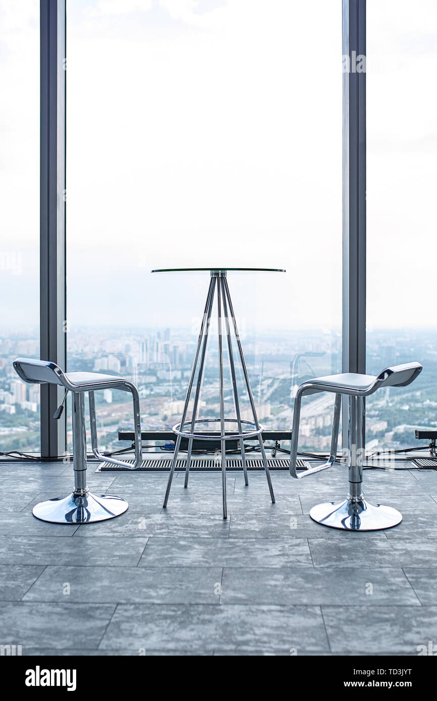 Concept talk with God. A platform on a high-rise building, a table and ...