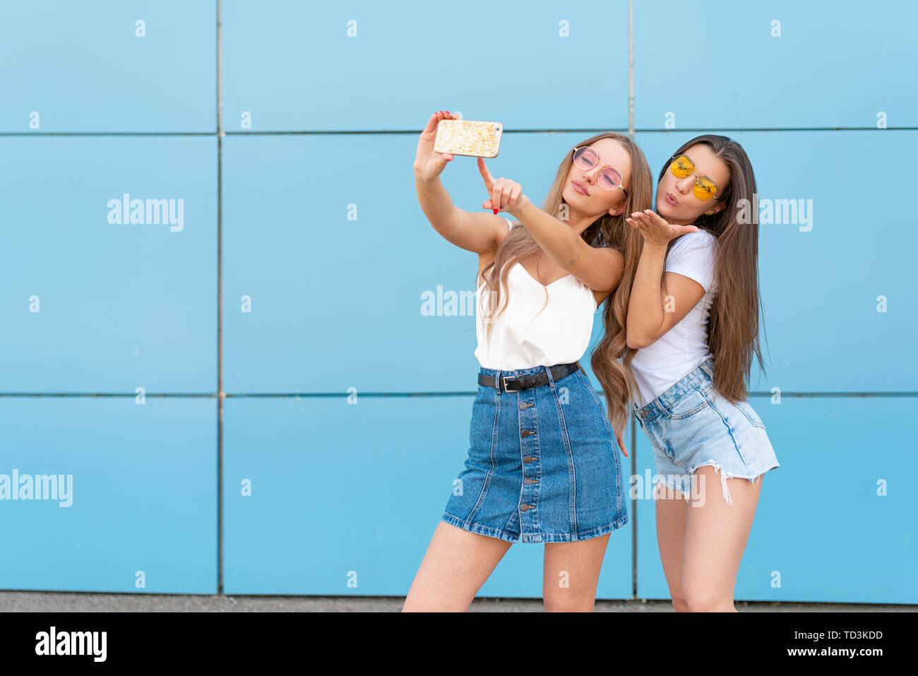 Fashion Portrait Of Two Pretty Smiling Hipsters Woman In Sunglasses