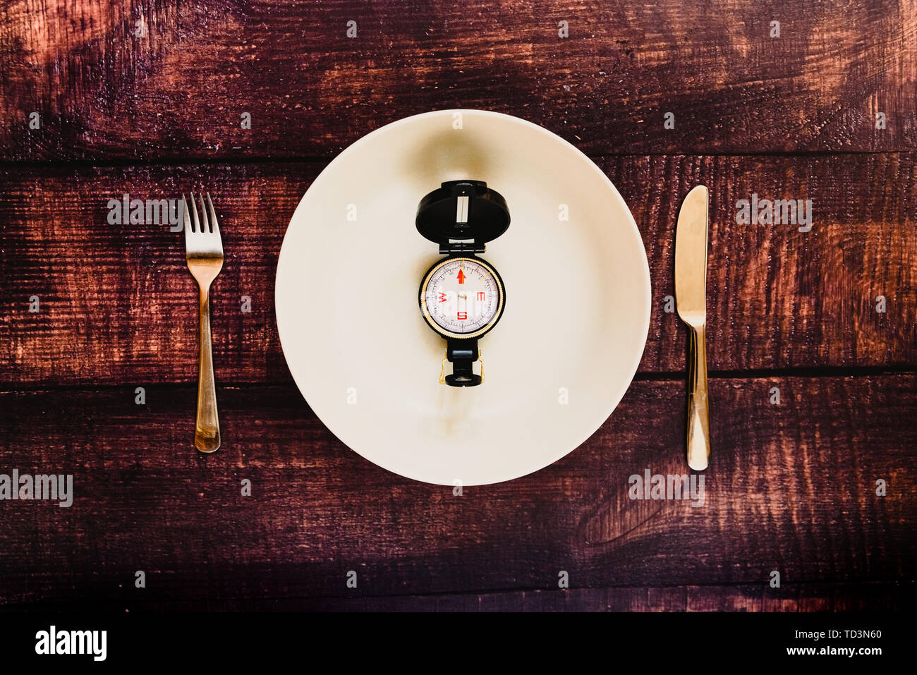 Intermittent fasting diet to lose weight illustrated with an empty ...