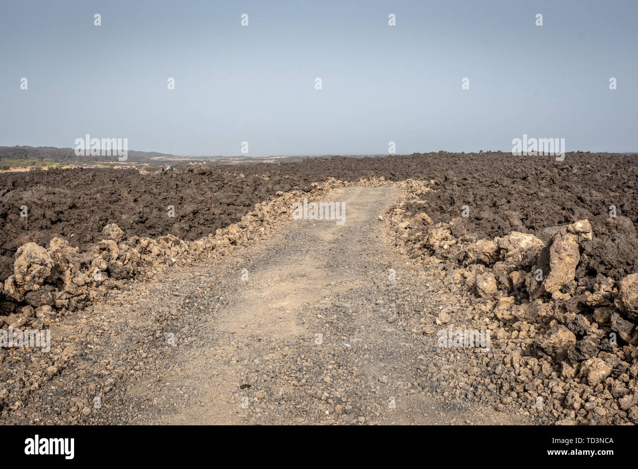 A dirt road leading to Erta Ale Volcano, a continuously active basaltic ...