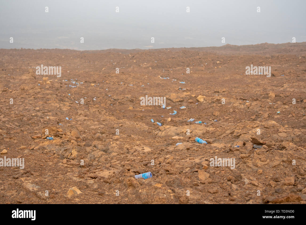 Plastic litter covers the landscape outside of the Erta Ale Volcano, a ...