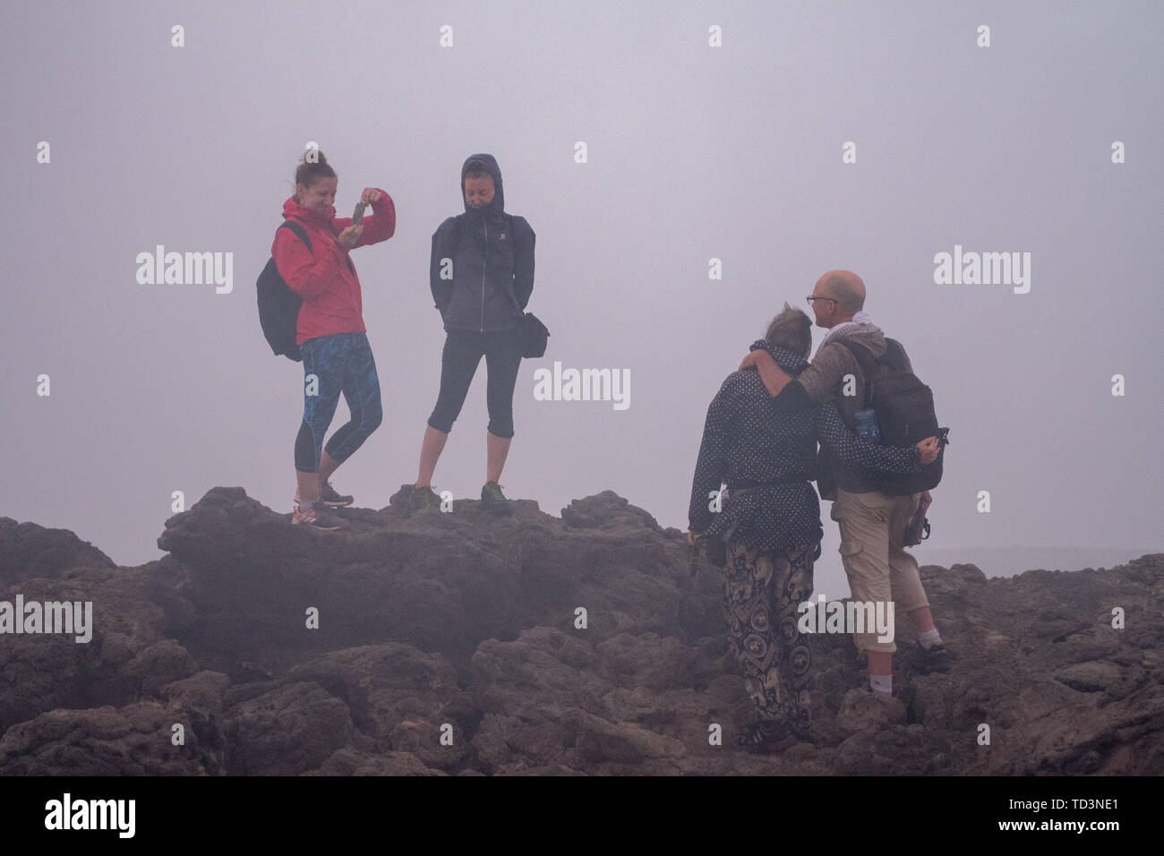 Tourists taking photographs at the Erta Ale Volcano, a continuously ...