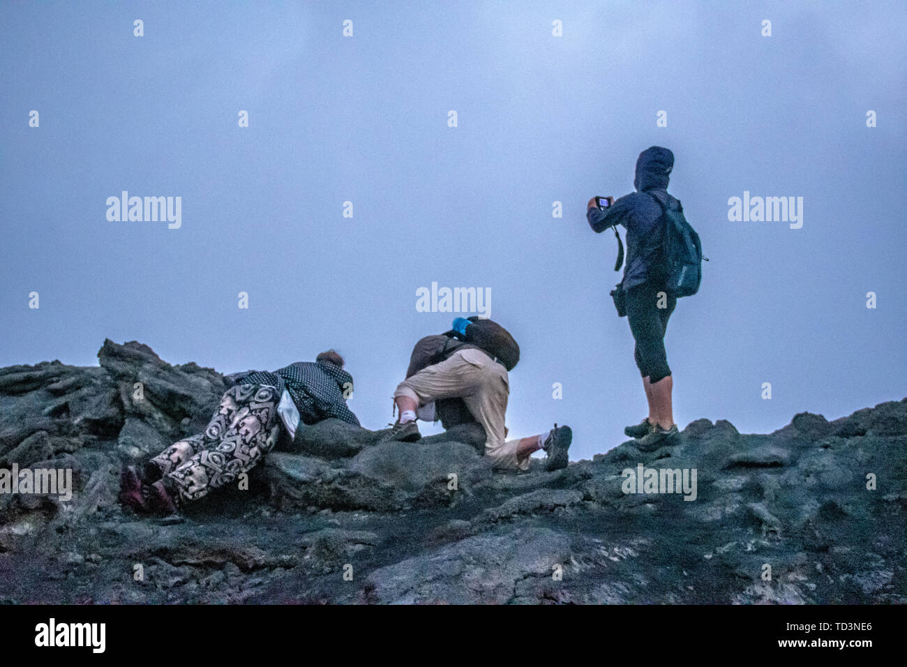 Tourists taking photographs at the Erta Ale Volcano, a continuously ...