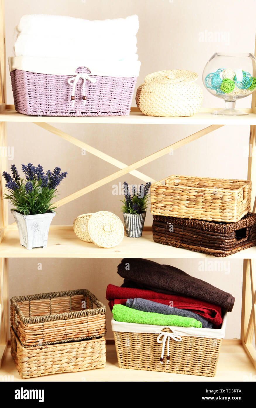 Beautiful white shelves with different home related objects, on color ...