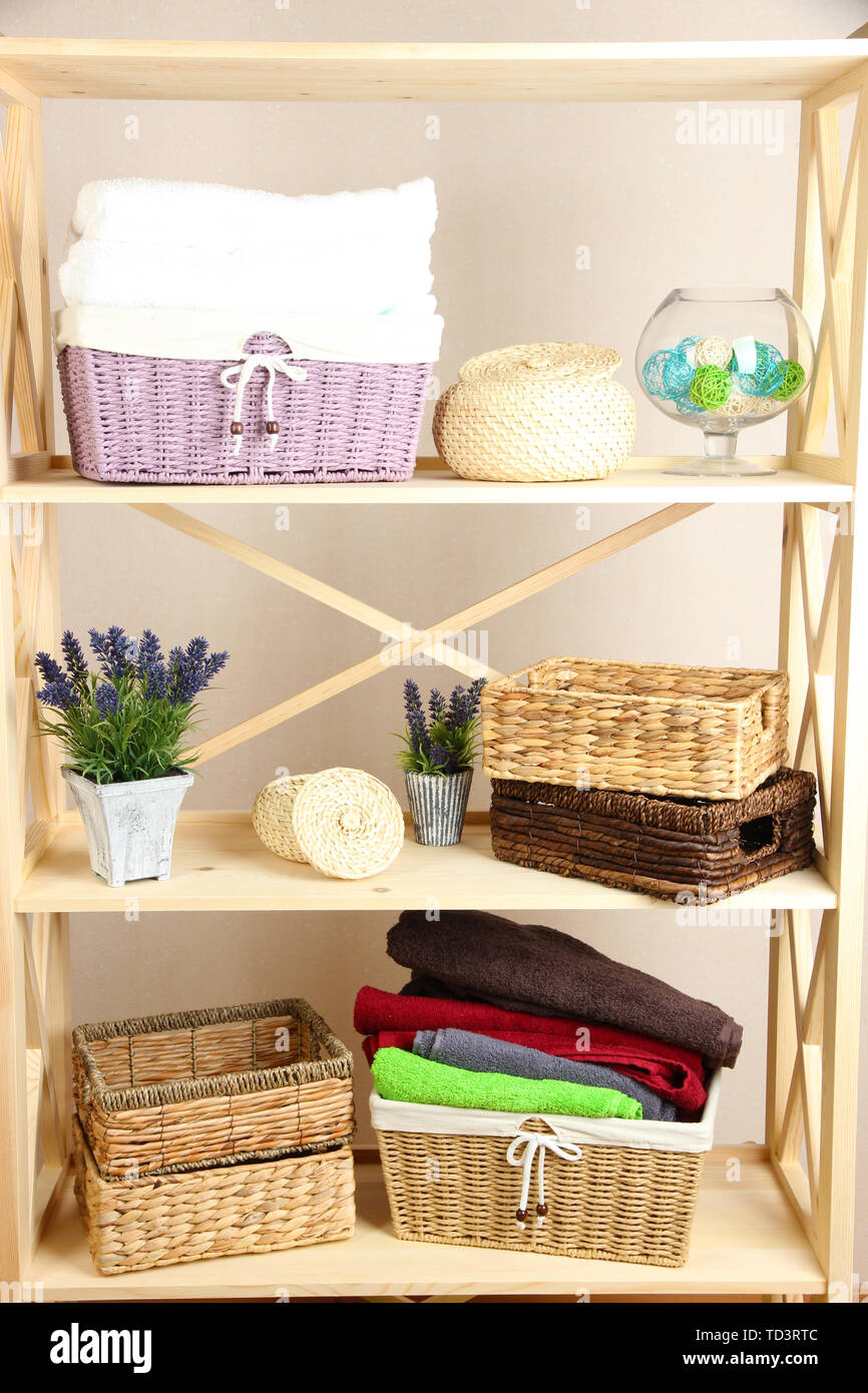 Beautiful white shelves with different home related objects, on color ...