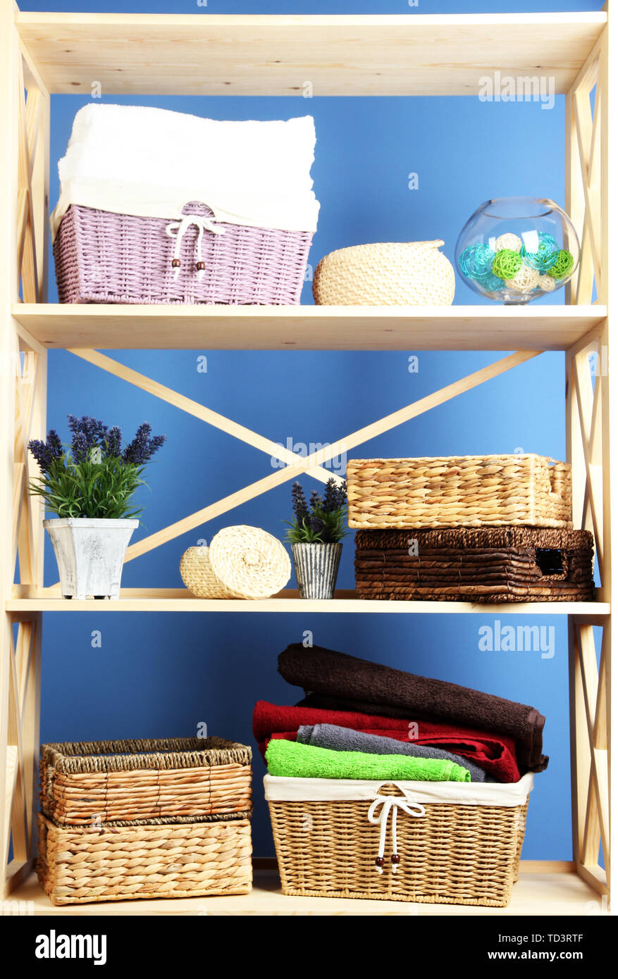 Beautiful white shelves with different home related objects, on color ...