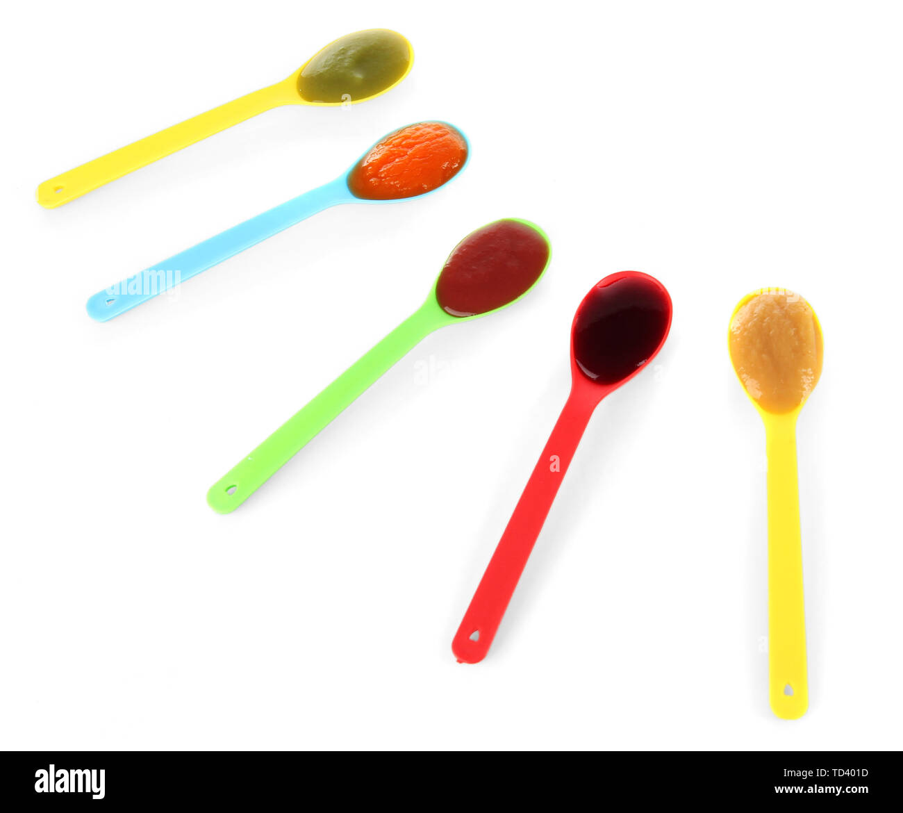 Baby puree in spoons isolated on white Stock Photo - Alamy