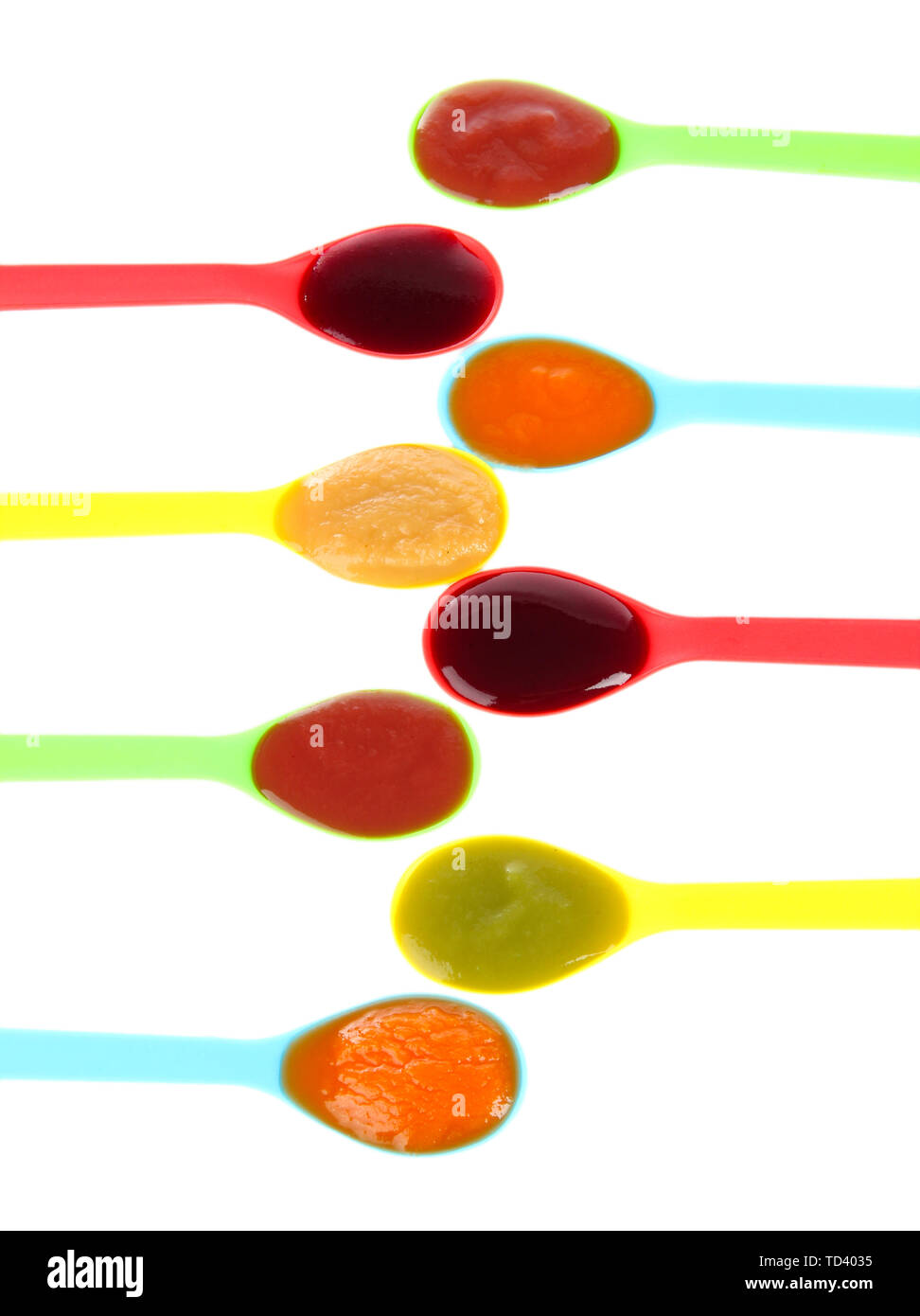 Baby puree in spoons isolated on white Stock Photo - Alamy
