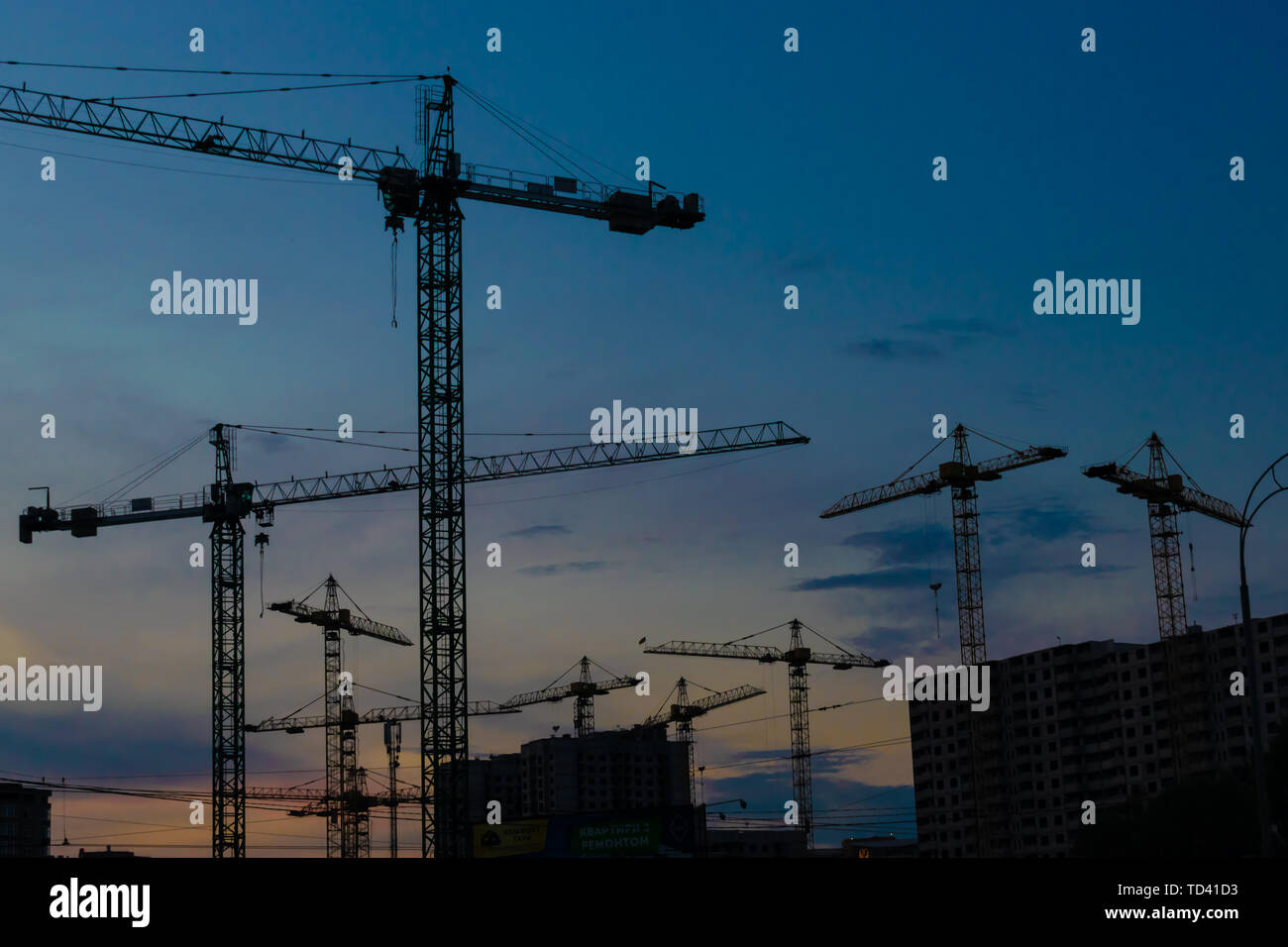 Group tall construction cranes hi-res stock photography and images - Alamy
