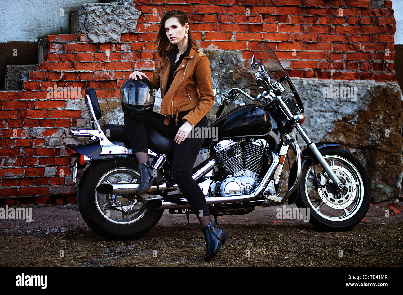 Portrait of beautiful young woman posing with motorcycle Stock Photo ...