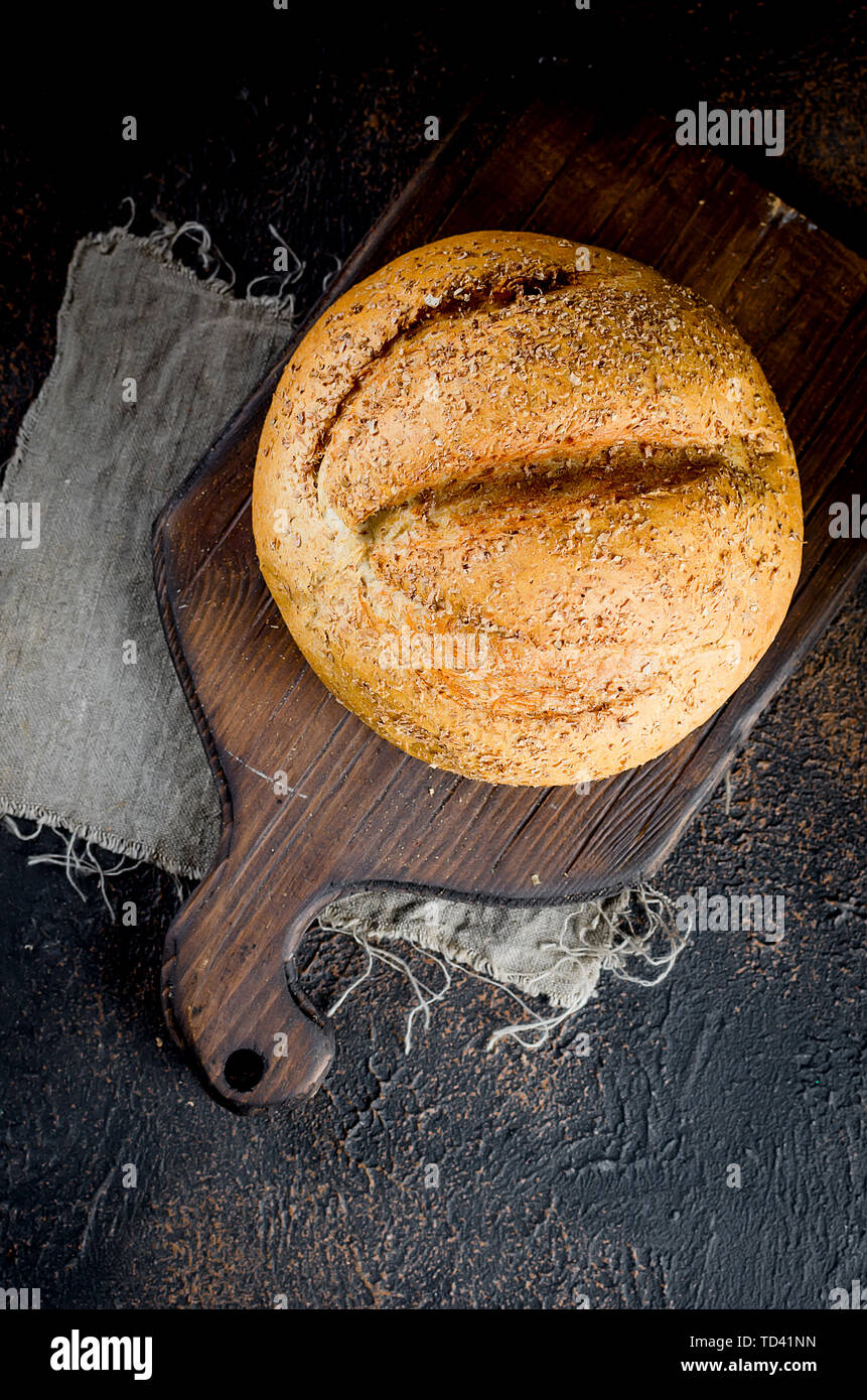 Circle Loaf of Rye bread on black background, healthy concept, copy ...