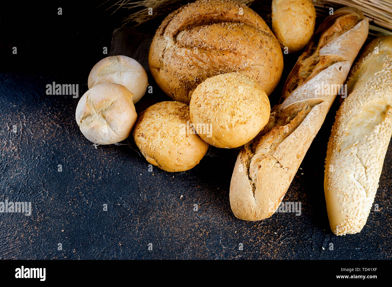 assortment of different types of bread, loaf, baguettes, loaves, rolls ...