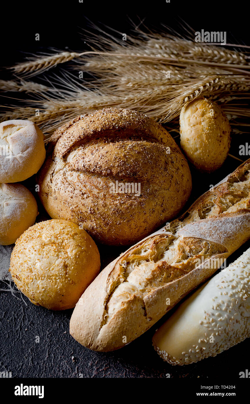 assortment of different types of bread, loaf, baguettes, loaves, rolls ...
