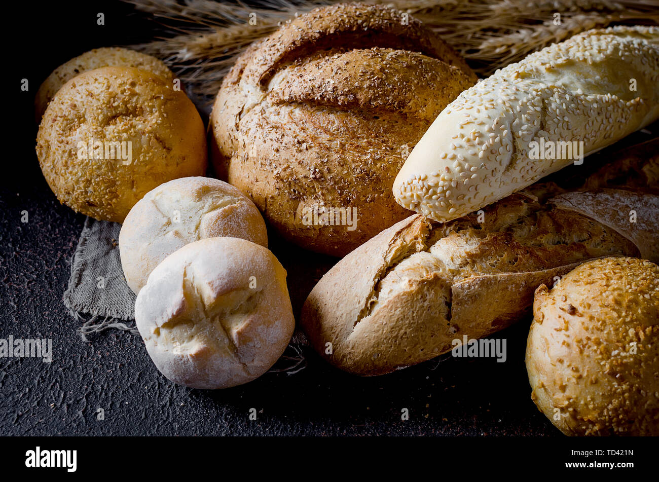 assortment of different types of bread, loaf, baguettes, loaves, rolls ...