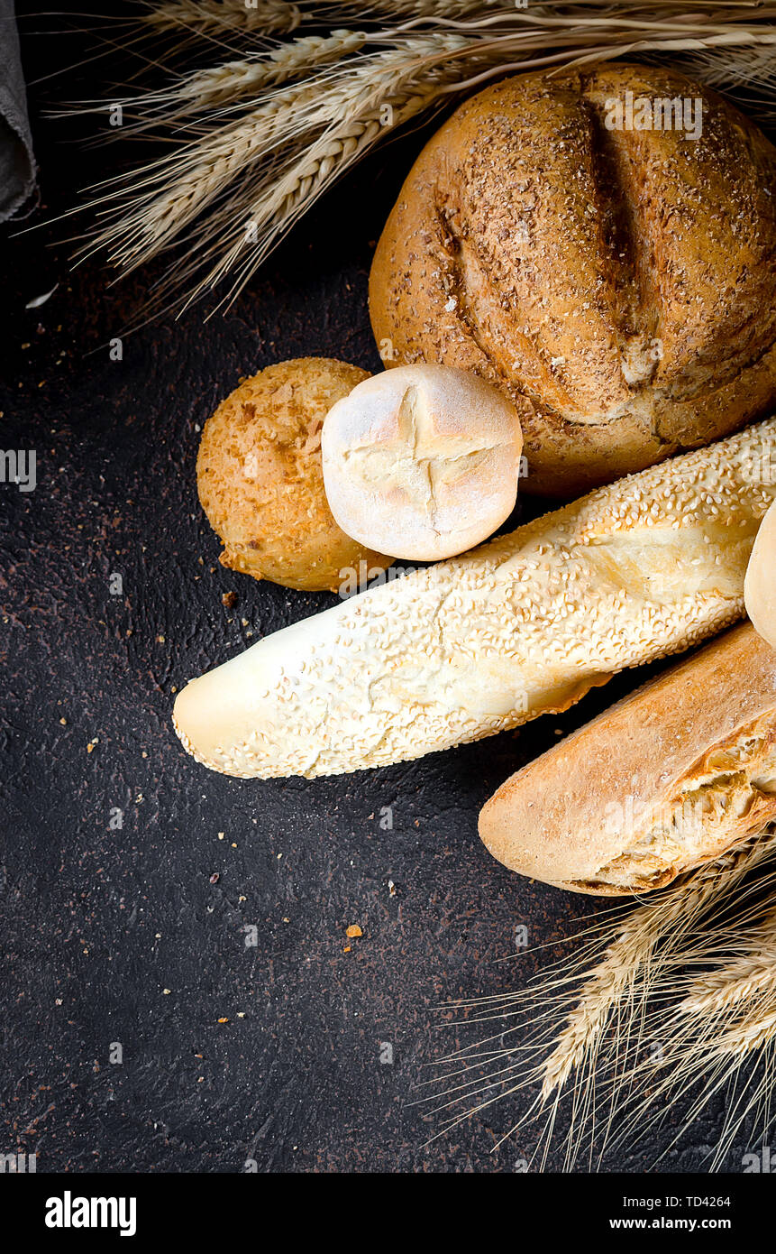 assortment of different types of bread, loaf, baguettes, loaves, rolls ...
