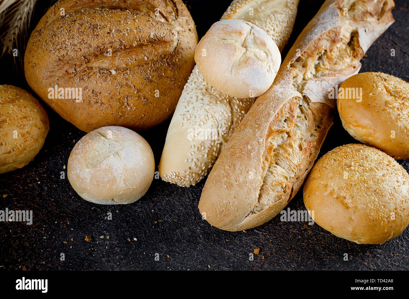 assortment of different types of bread, loaf, baguettes, loaves, rolls ...