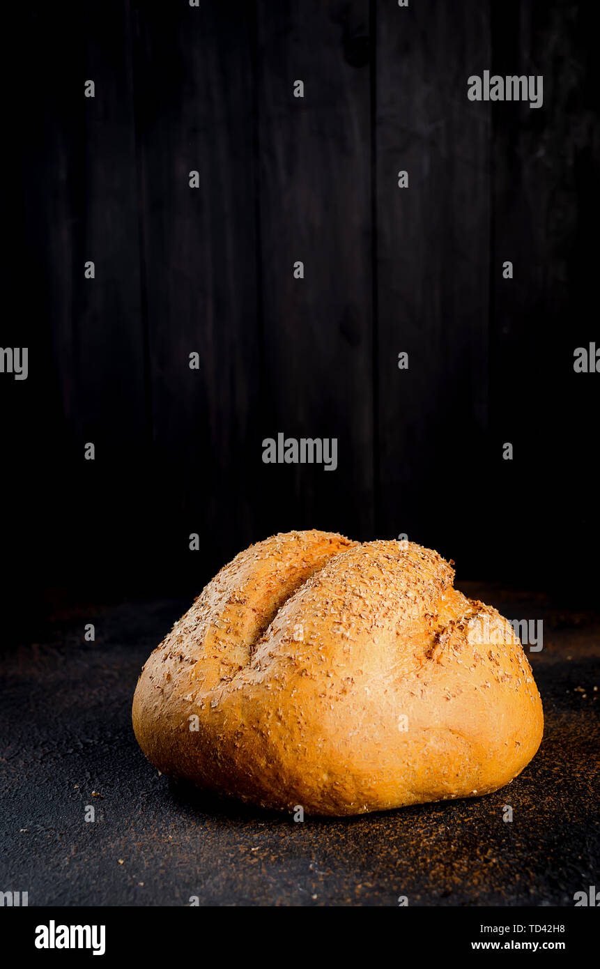 Circle Loaf of Rye bread on black background, healthy concept, copy ...