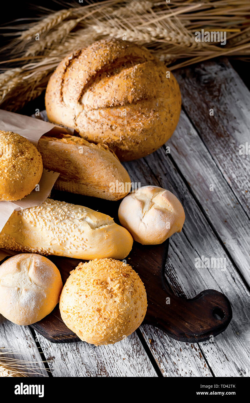 assortment of different types of bread, loaf, baguettes, loaves, rolls ...