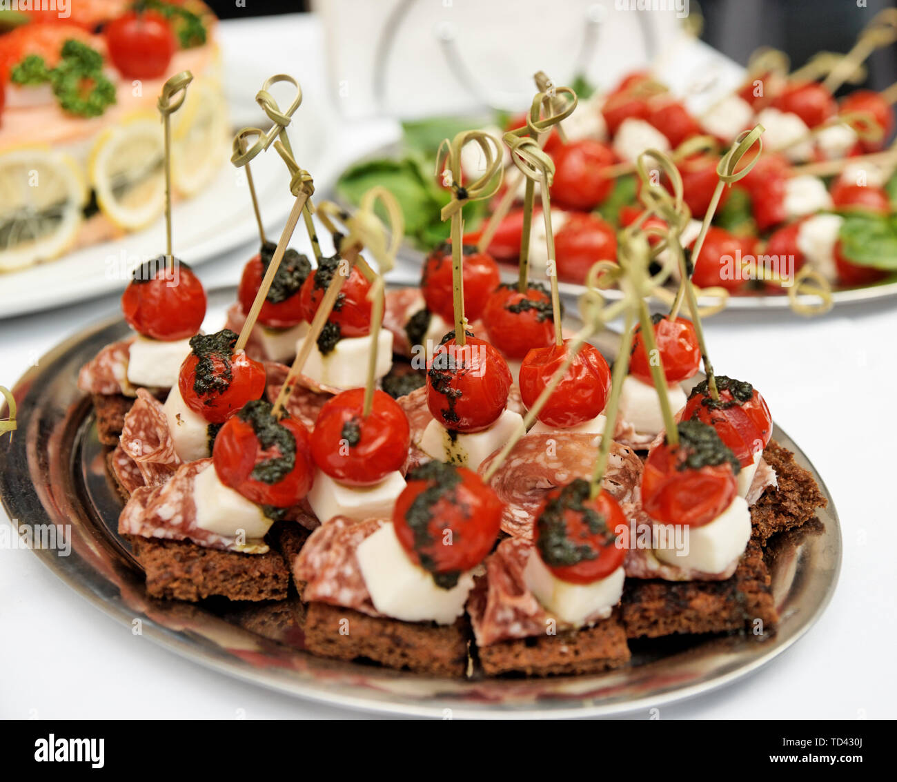 Canapes with choriso wurst on a metal platter Stock Photo - Alamy