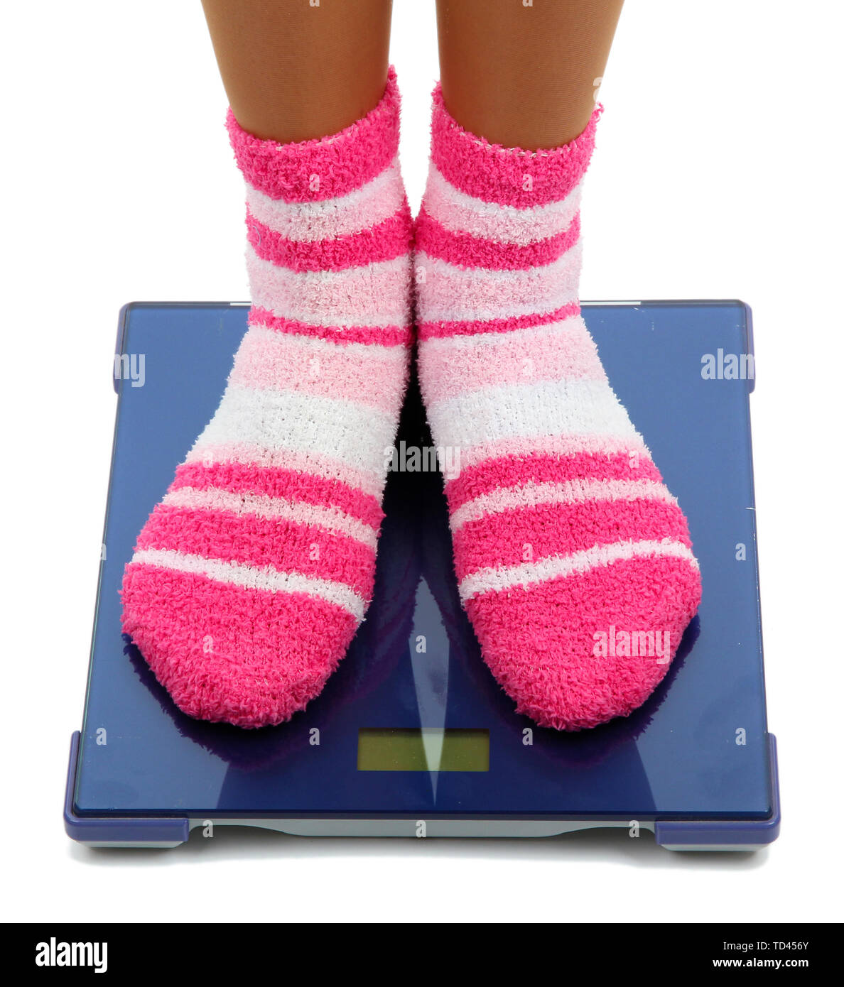 Feet on scales isolated on white Stock Photo - Alamy