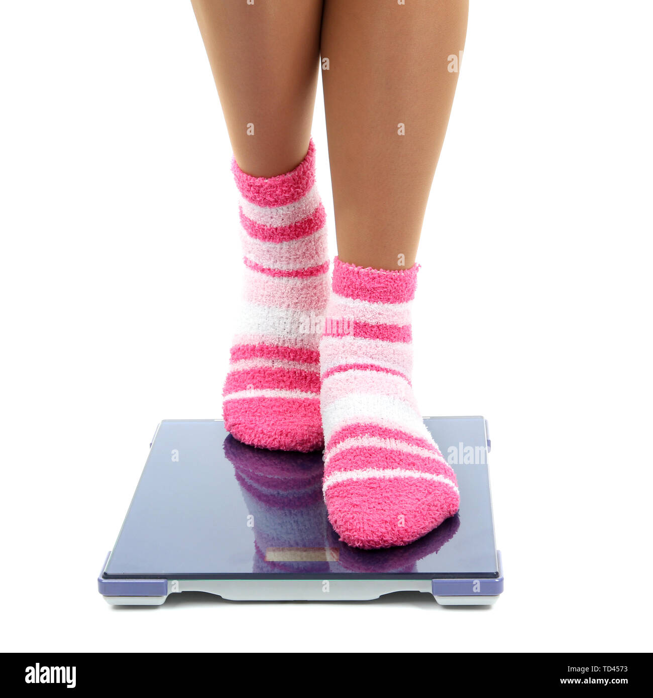 Feet on scales isolated on white Stock Photo - Alamy