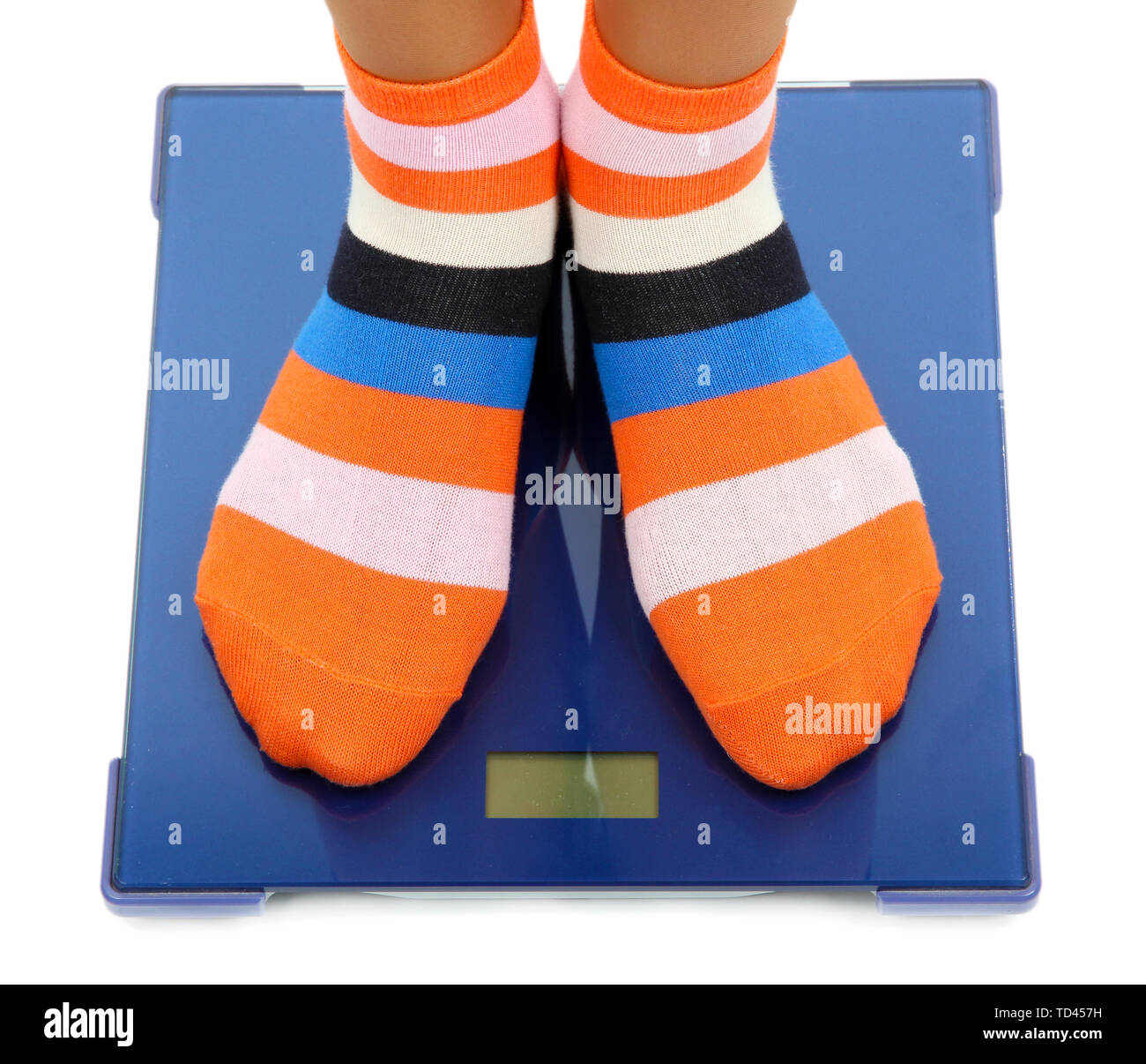 Feet on scales isolated on white Stock Photo - Alamy