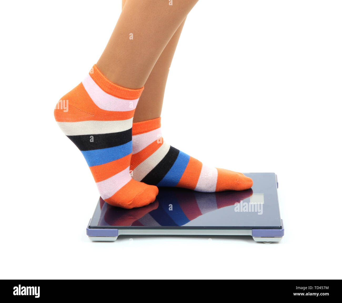 Feet on scales isolated on white Stock Photo - Alamy