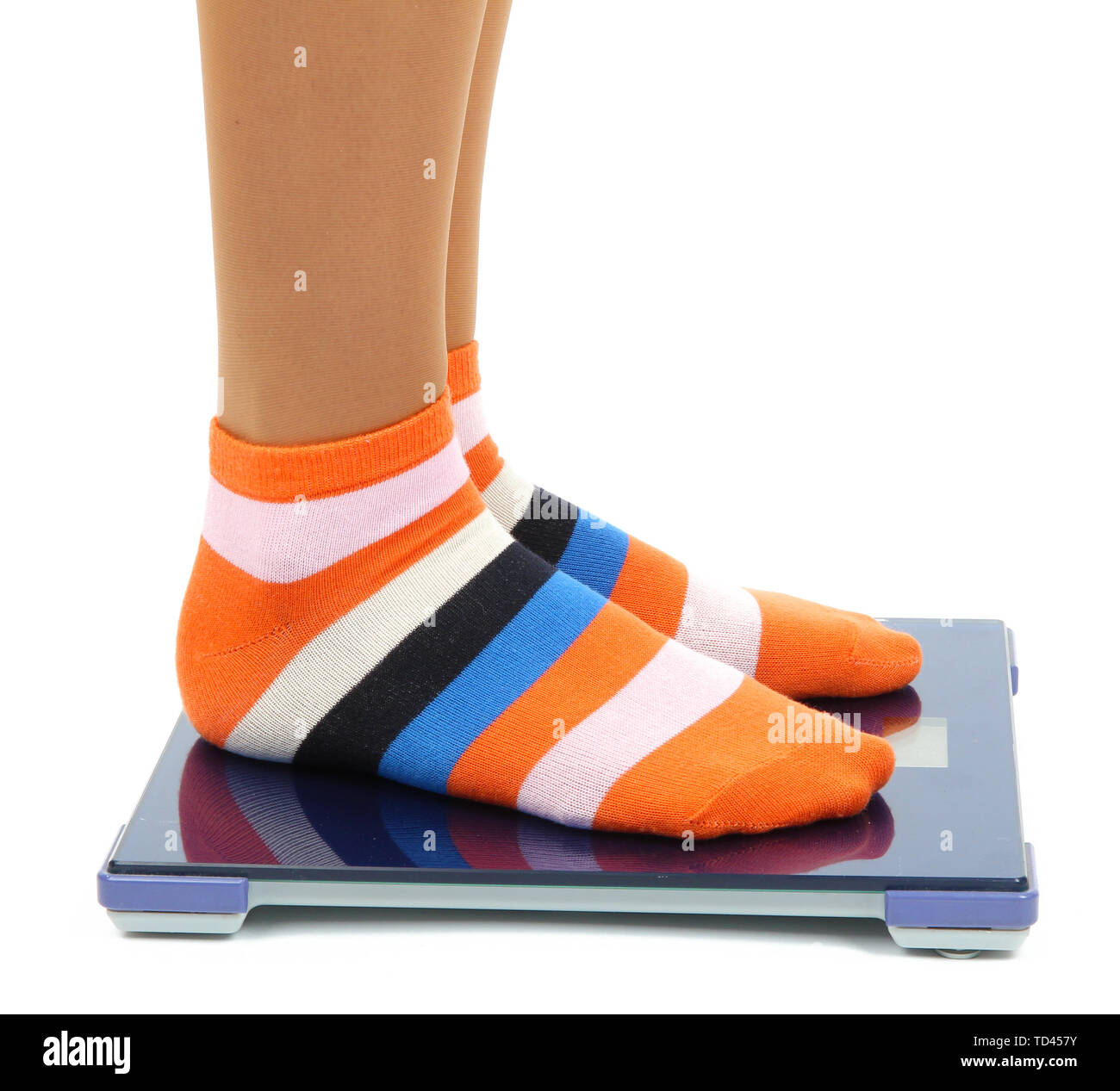 Feet on scales isolated on white Stock Photo - Alamy