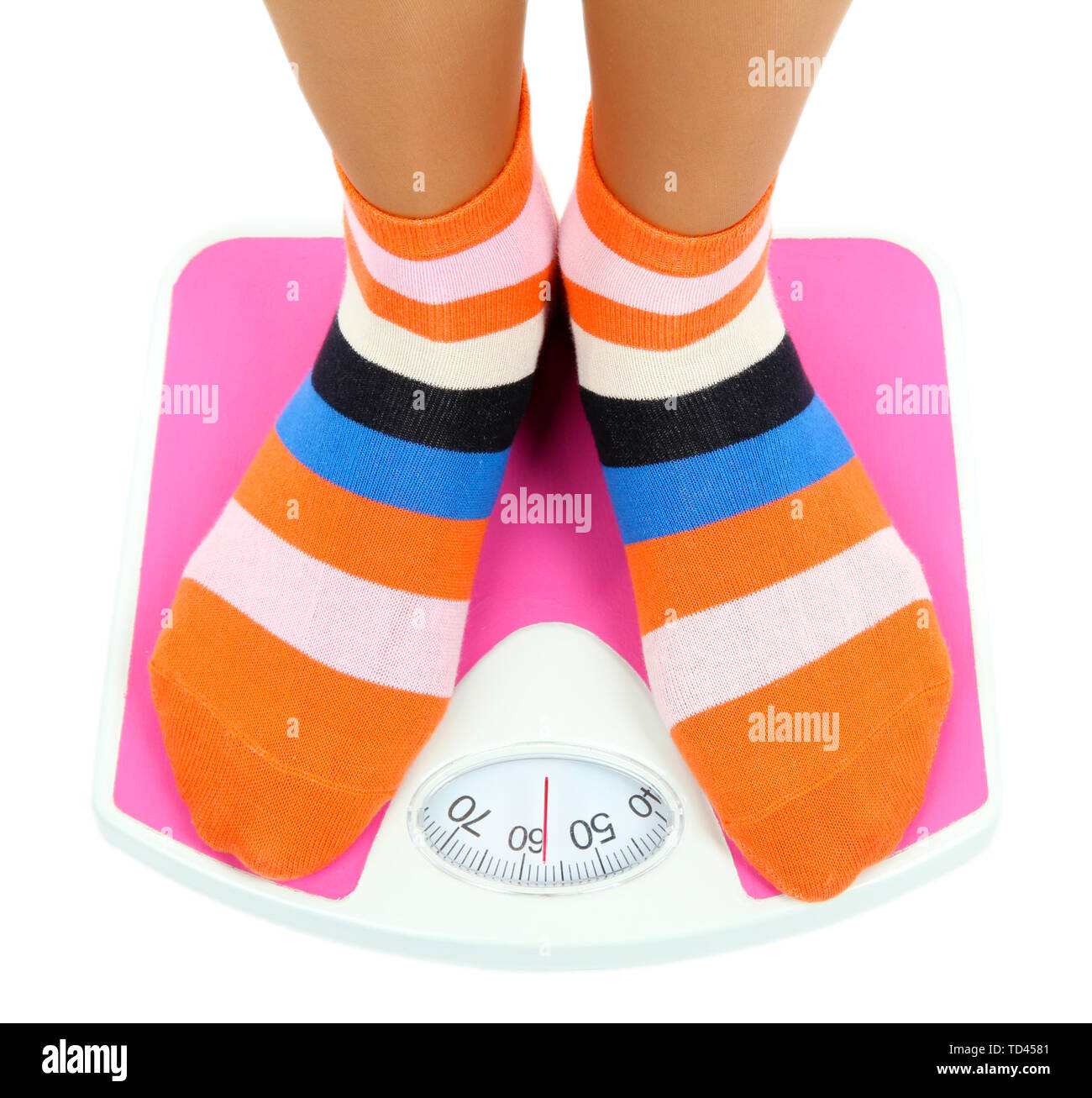 Feet on scales isolated on white Stock Photo - Alamy