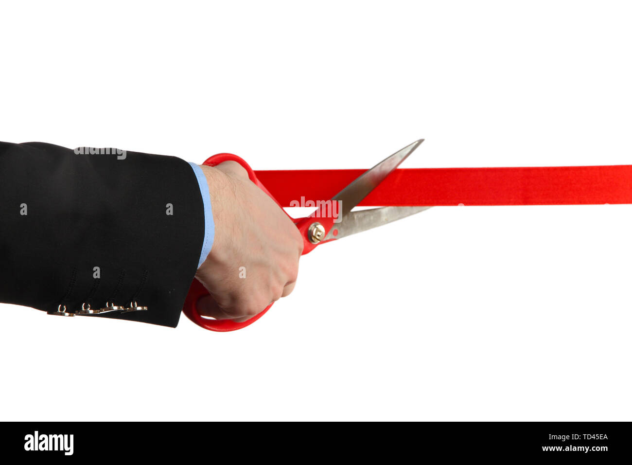 Man's hand cutting red ribbon with pair of scissors isolated on white ...