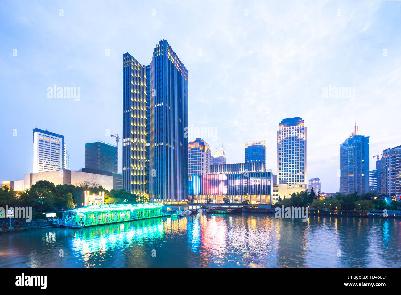 modern office buildings near water at twilight Stock Photo - Alamy