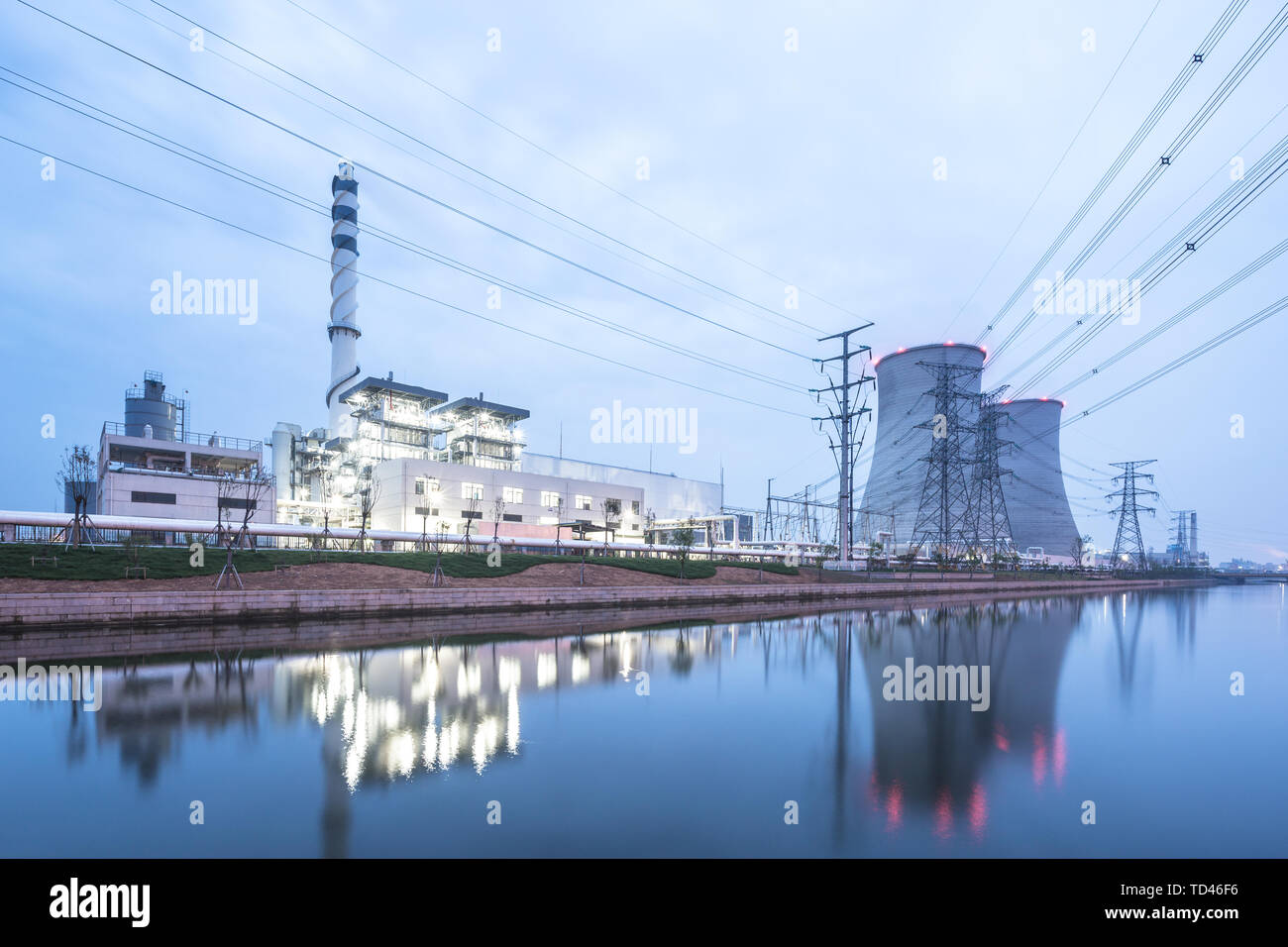 modern factory near river in blue sky at dawn Stock Photo - Alamy