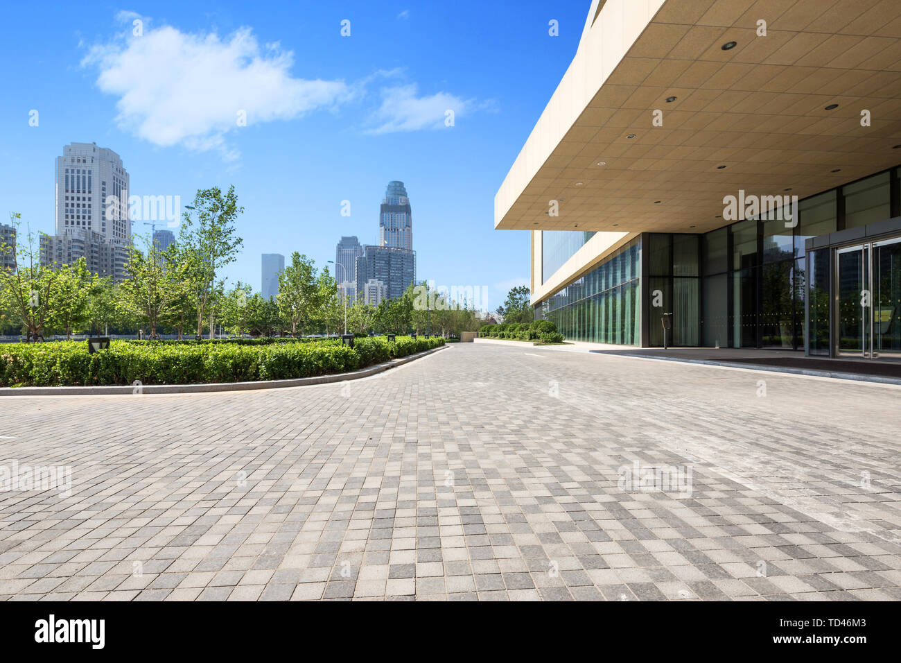 office building exterior with brick road floor Stock Photo - Alamy