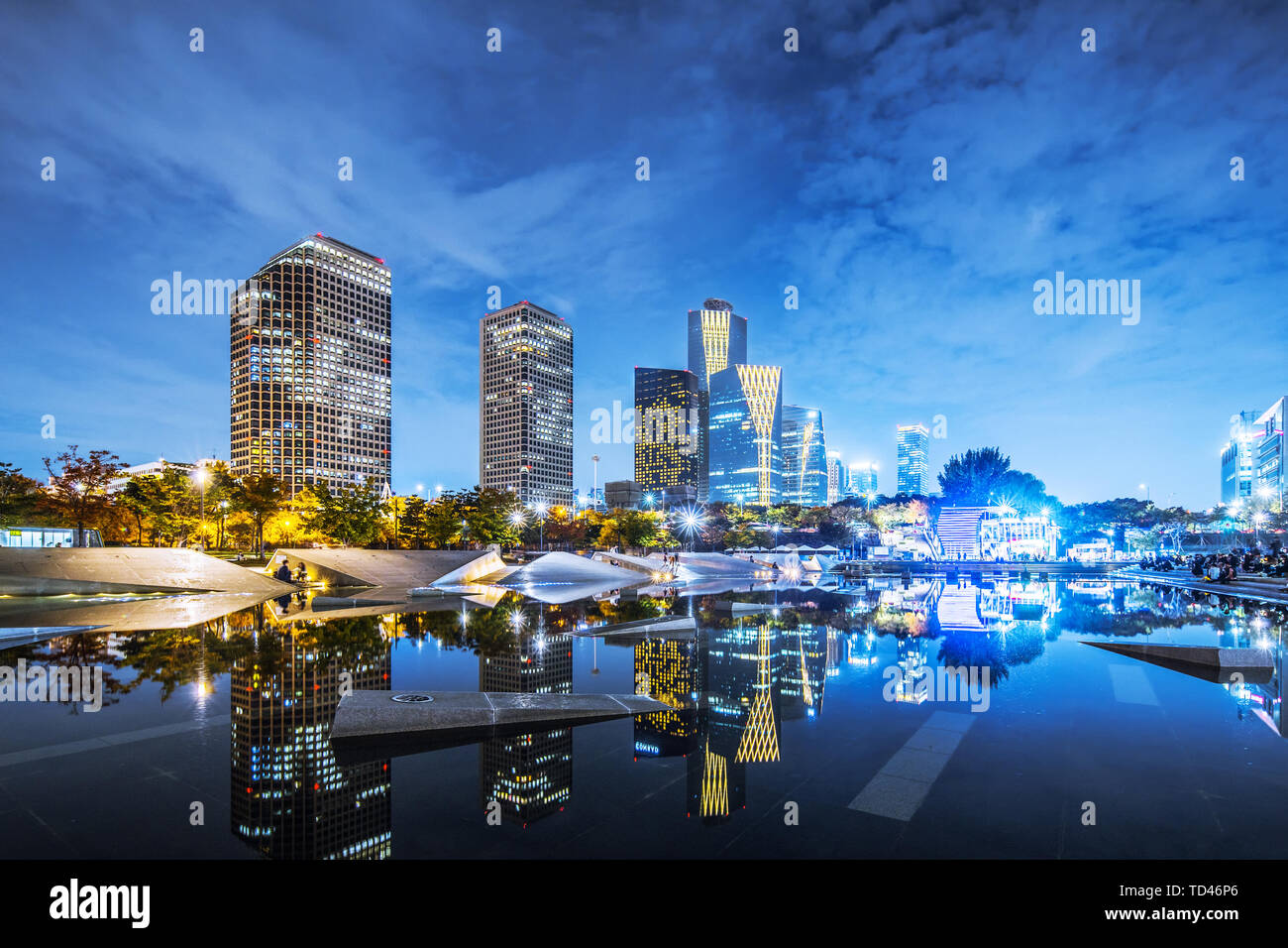 modern office buildings near water at night in seoul Stock Photo - Alamy