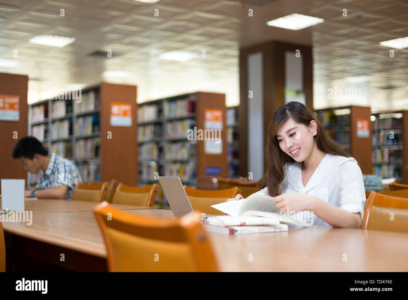 Asian beautiful female student study in library with laptop Stock Photo ...