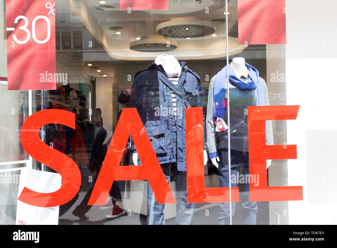Sale Sign In A Clothing Store Window Stock Photo - Alamy
