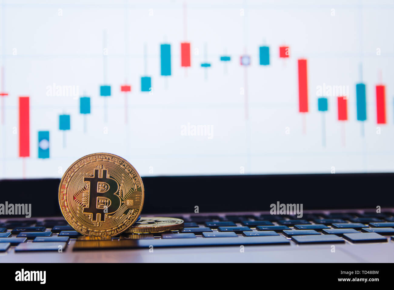 golden bitcoin on keyboard laptop with forex trading graph background ...