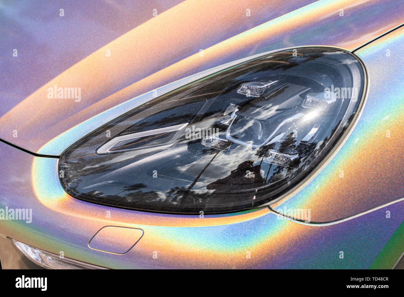 Close-up LED headlight expensive car part with exclusive iridescent ...